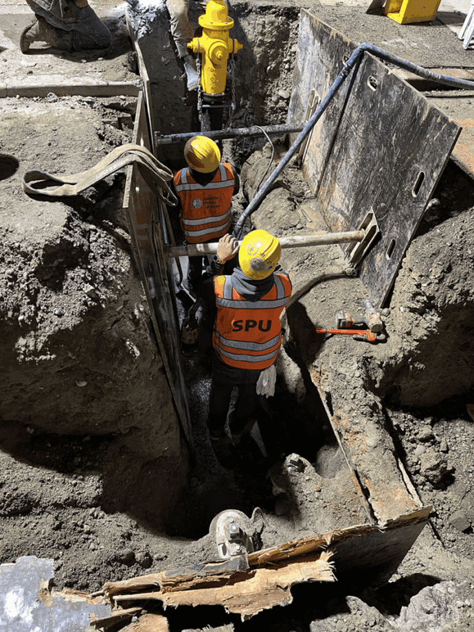 SPU crews work in a deep trench to install a new fire hydrant – Metro ...